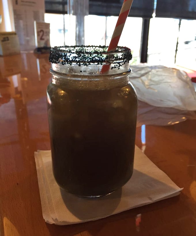 Sweet tea in a mason jar with a blackened sugar rim—because sometimes your beverage deserves as much attention as your main course.