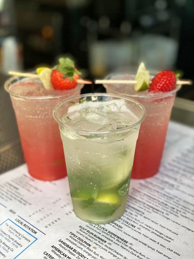Cocktails that look like Florida sunsets taste twice as good. That strawberry garnish isn't just pretty—it's plotting to steal your heart.