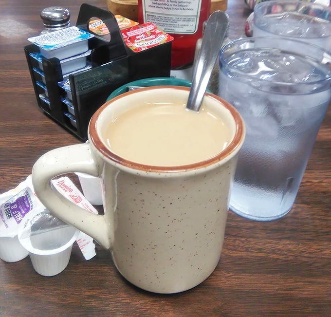 The classic diner mug—speckled, sturdy, and filled with coffee that somehow tastes better than what you brew at home. The true unsung hero of breakfast culture.