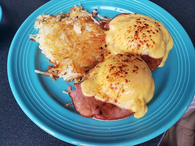 Eggs Benedict topped with hollandaise sauce looks almost too pretty to eat, but let's be honest, you're definitely eating it immediately.