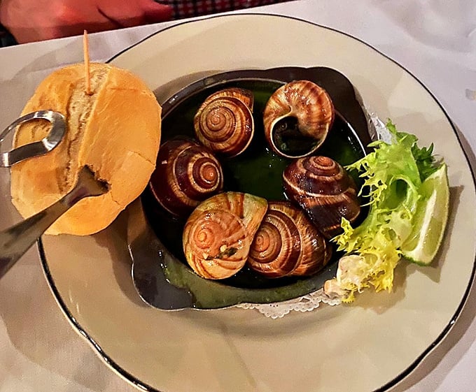 Escargot swimming in herb-flecked butter—like tiny flavor submarines waiting to transport you to a Burgundian bistro without leaving Virginia.