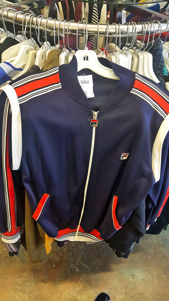 That vintage Fila track jacket isn't just clothing—it's a wearable time capsule from when hip-hop and sportswear first fell madly in love.