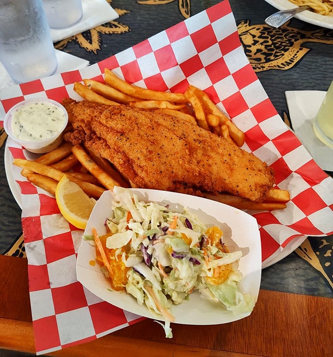 Fish and chips served on checkered paper – the universal signal that something gloriously unpretentious and delicious has arrived at your table.