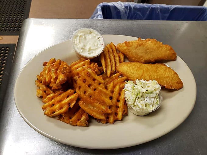 Waffle fries and fish that would make a British pub regular consider permanent American citizenship. The coleslaw side isn't just an afterthought.
