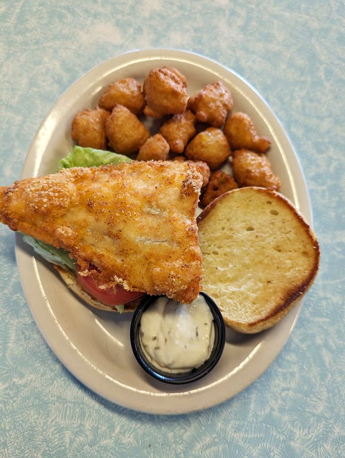 This isn't just a fish sandwich – it's a golden-fried masterpiece with a side of perfectly crispy tater tots that would make any lunch break memorable.