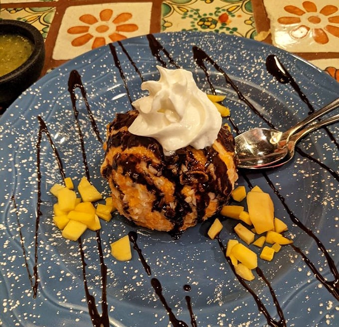 Fried ice cream that solves the paradox of hot and cold – like finding a snowball in the desert that somehow tastes like cinnamon and honey.