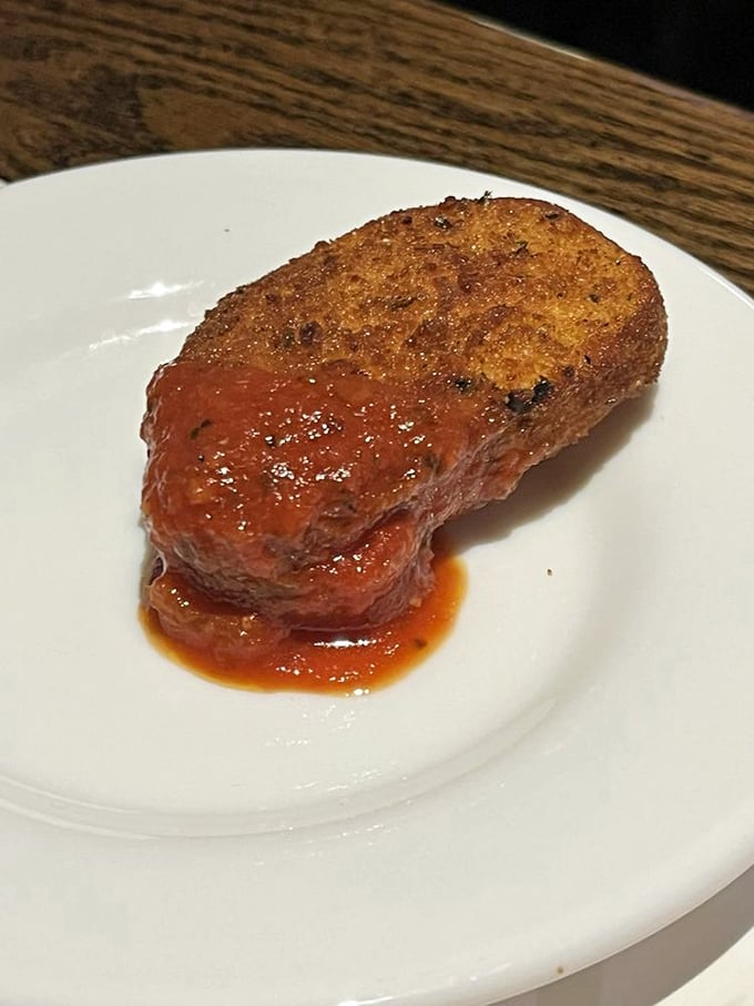 Not just any fried mozzarella—this is the aristocrat of appetizers, wearing a golden crust like it's dressed for a night at the opera.