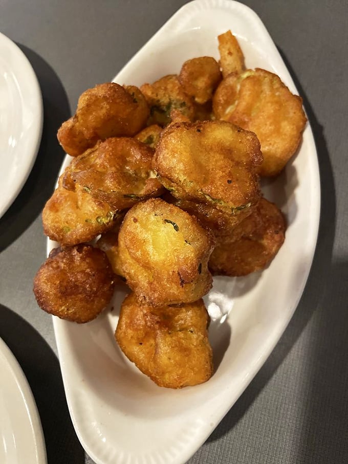 Fried pickles: where tangy meets crunchy in a dance of flavor. These golden discs are the unsung heroes of the appetizer world.