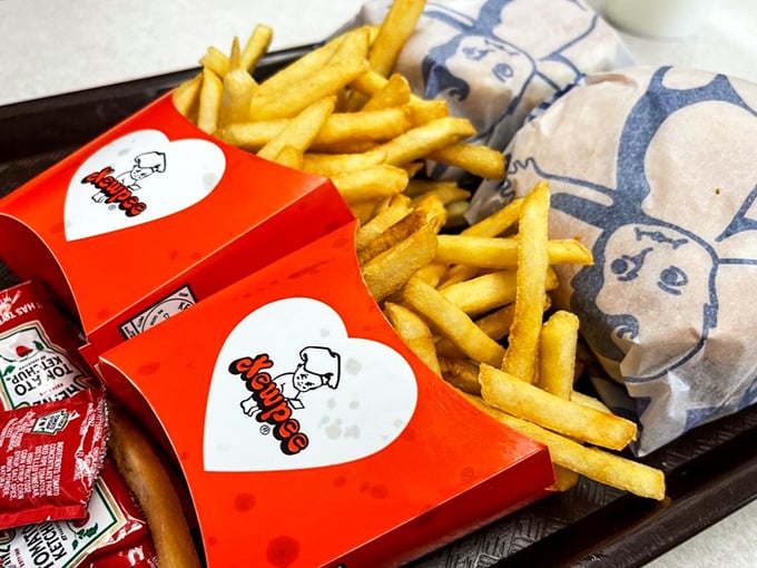 Golden fries nestled in their signature red boxes—crisp, hot, and ready to play the perfect supporting role to your burger's star performance.