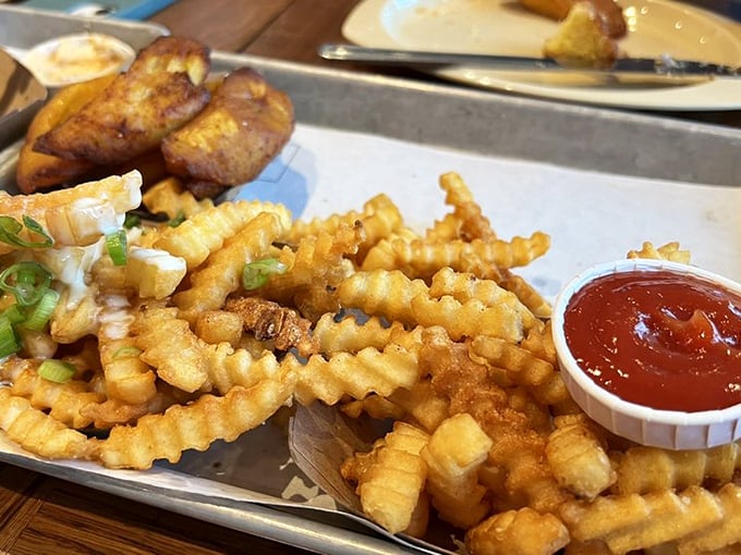 Crinkle-cut fries and sweet plantains sharing a tray—proof that different backgrounds can make for the most delicious friendships.