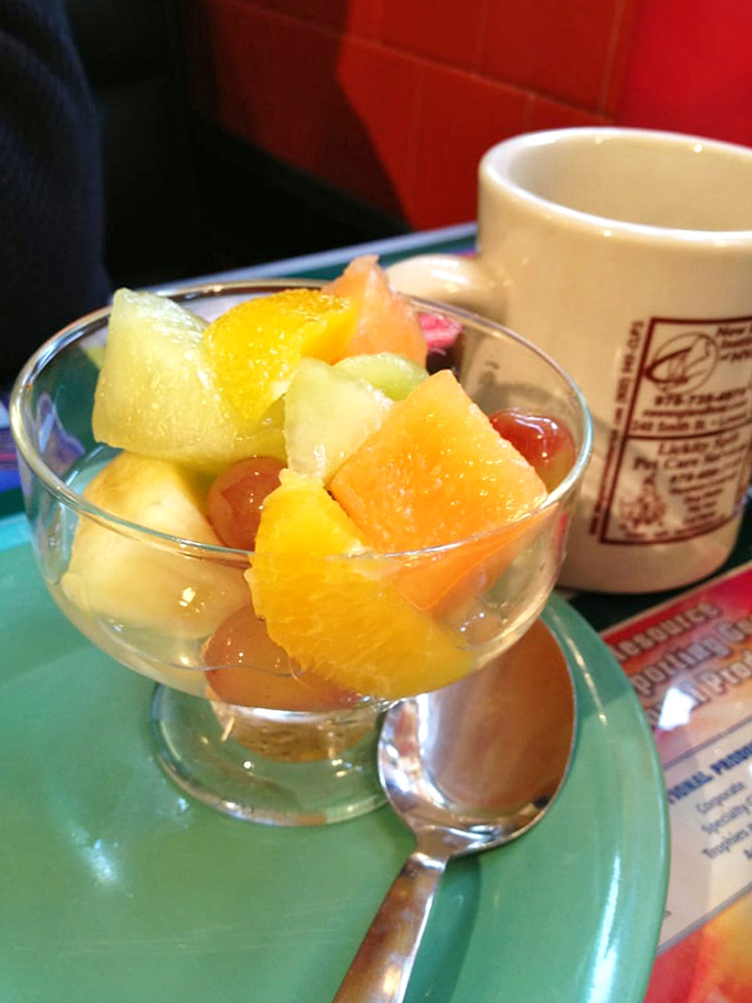 Fresh fruit that actually tastes like fruit! A simple pleasure alongside that signature Owl Diner coffee mug – breakfast balance at its finest.