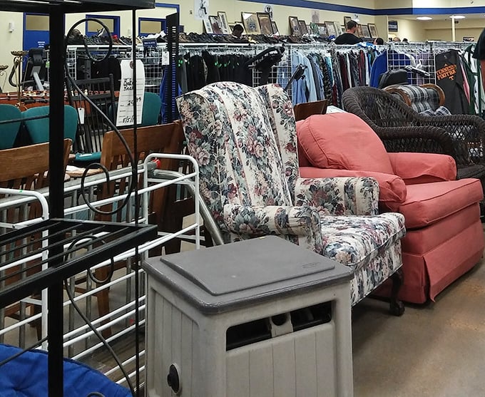 Furniture with character—that floral armchair has seen things. The coral sofa? Perfect for someone brave enough to make a statement in their living room.