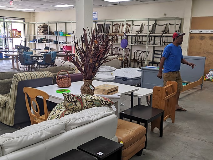 The furniture section—where mid-century meets last-century in a showroom that tells a hundred stories of American living rooms.