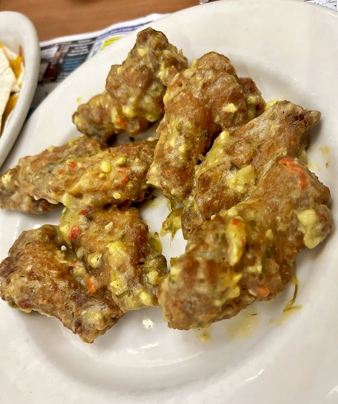 These garlic parmesan wings aren't just appetizers – they're conversation stoppers that demand your full attention and possibly an extra napkin.