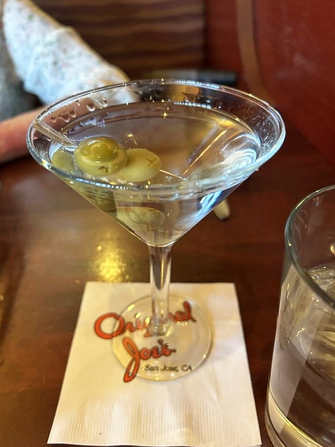 A properly made martini is civilization in a glass – three olives standing at attention like they know they're part of something important.