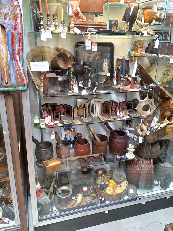 This glass case doesn't just display antiques—it showcases the everyday artifacts that built America, one household at a time.