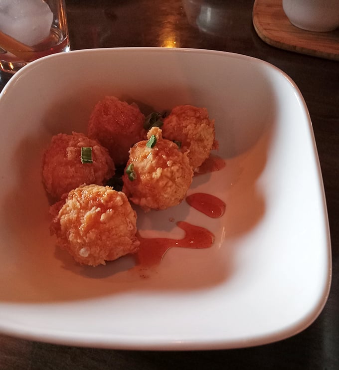 These goat cheese fritters aren't just appetizers—they're little orbs of joy that make you question why you'd ever waste stomach space on lesser starters.