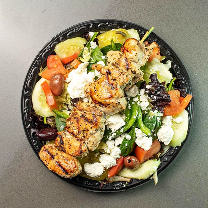 Even the salad gets the royal treatment—grilled chicken and fresh vegetables proving that "eating light" doesn't mean sacrificing flavor in barbecue country.