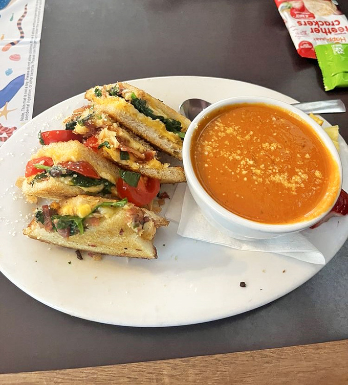 A grilled cheese that would make your childhood self weep with joy, paired with soup that doesn't come from a can. This is what growing up was meant for.
