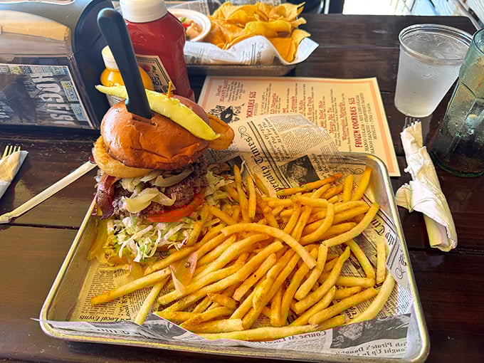 When a burger earns its place on a seafood menu, you know it's something special—this towering creation demands a two-handed commitment.