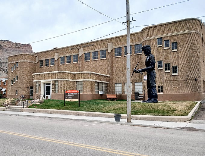 The Helper City Auditorium and its coal miner statue remind visitors that this town was built on hard work and grit, not just pretty scenery.