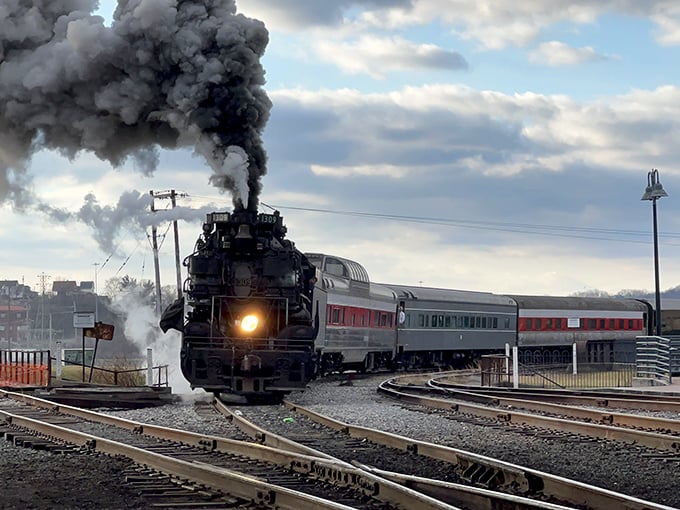 Nothing says "I'm working hard for you" quite like a steam locomotive billowing clouds against a moody sky.
