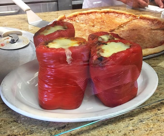 These stuffed peppers aren't just a side dish—they're the main event, wearing their melted cheese crowns with the confidence of food that knows it's irresistible.
