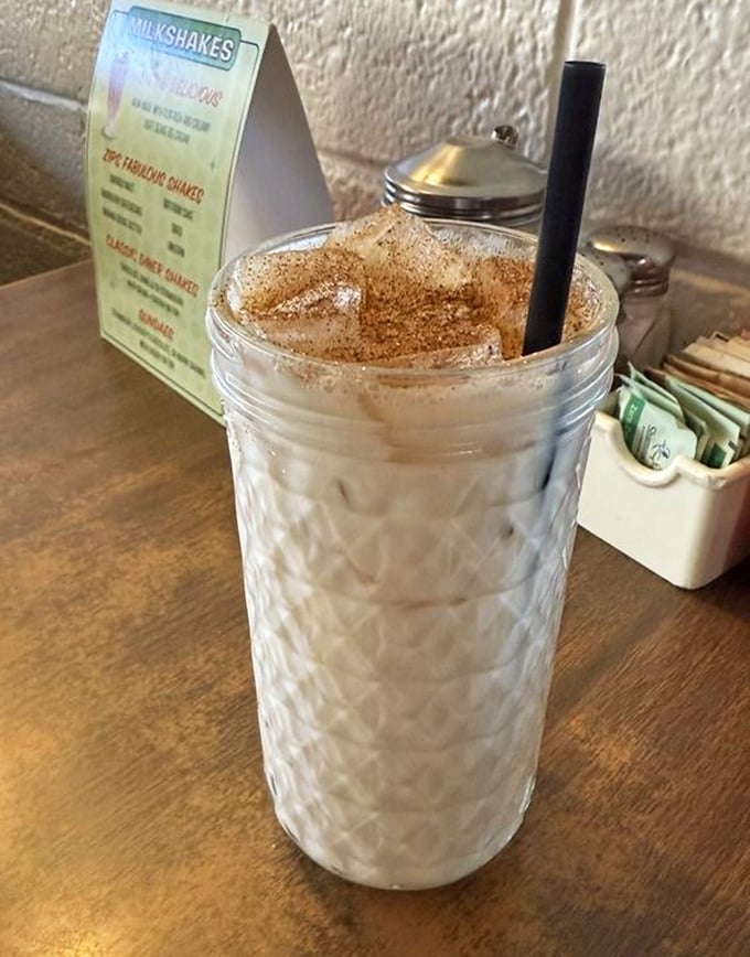 Cinnamon-dusted horchata in a quilted glass—the dessert disguised as a beverage that somehow makes Arizona heat feel like a blessing.