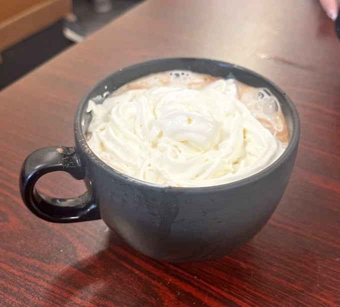 Hot chocolate that doesn't know it's in Florida—topped with a cloud of whipped cream that puts fancy coffee shops to shame.
