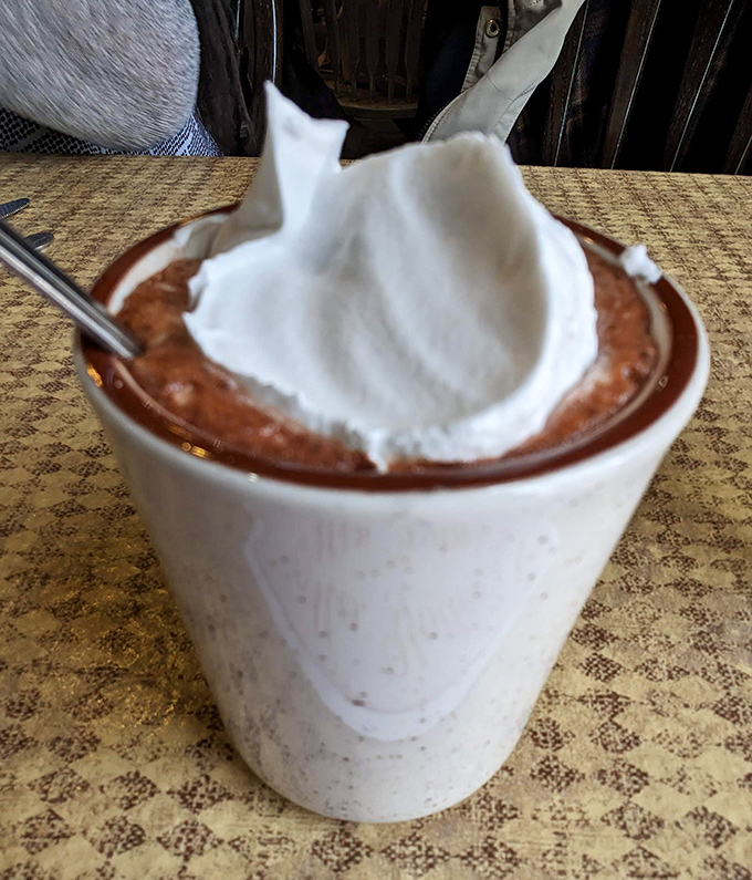 Hot chocolate crowned with whipped cream – winter's perfect antidote served in a no-nonsense mug.