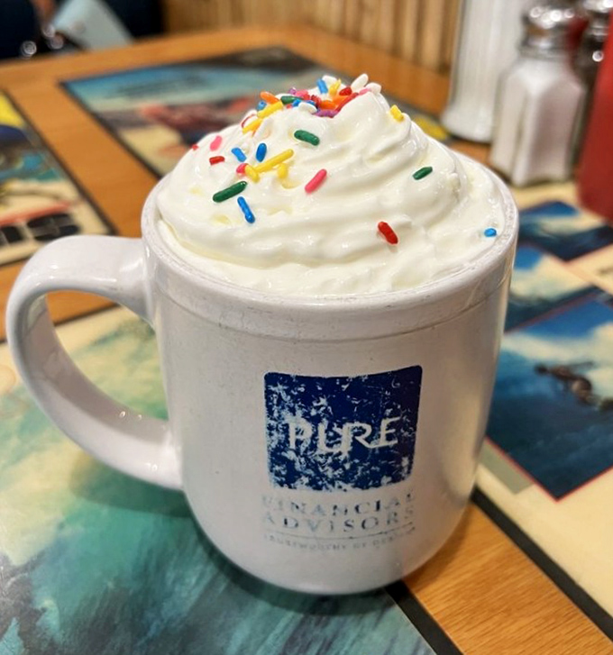 Not just hot chocolate—it's happiness in a mug. Those sprinkles are saying "life's too short for boring beverages."