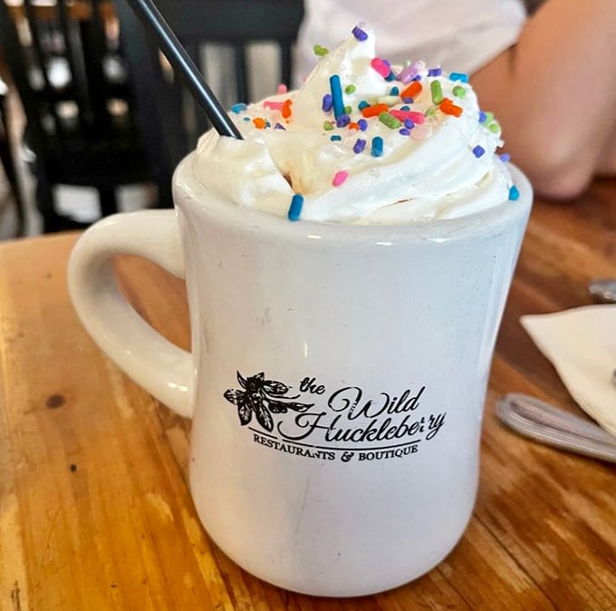 Not just hot chocolate—it's a celebration in a mug. Those rainbow sprinkles aren't just toppings; they're tiny ambassadors of joy.