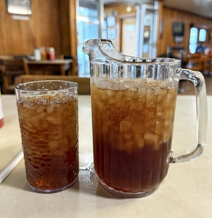 Sweet tea served in portions that acknowledge the seriousness of Southern thirst. That pitcher isn't just a serving vessel—it's a commitment to proper hydration.