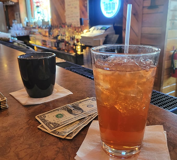 A glass of iced tea catching the bar lights just right — simple, crisp, and ready to cool down a long day the easy way.