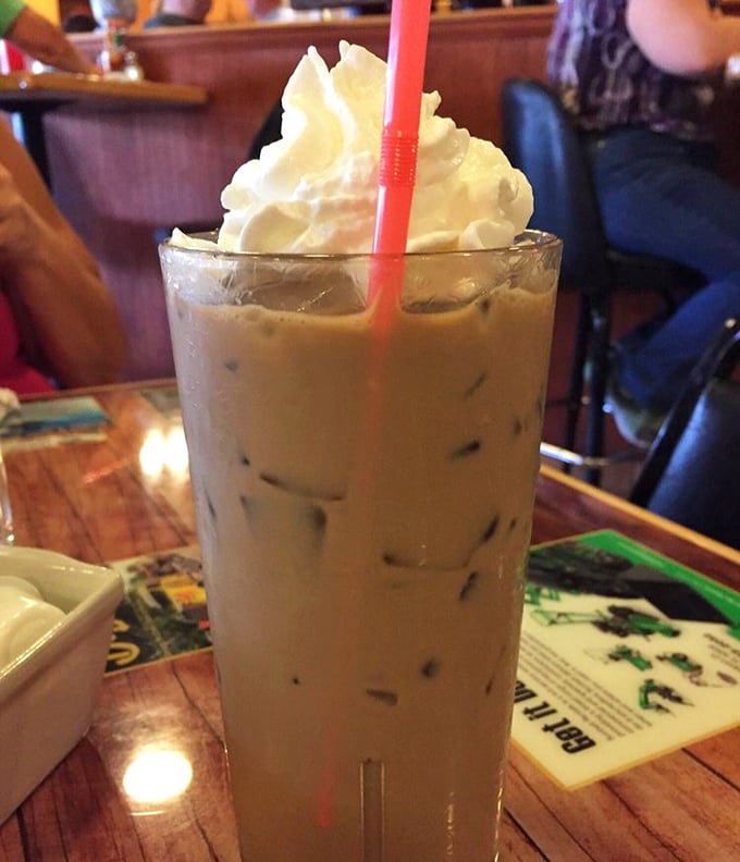 Iced coffee topped with whipped cream—because sometimes Monday mornings require both caffeine and dessert to face the world.