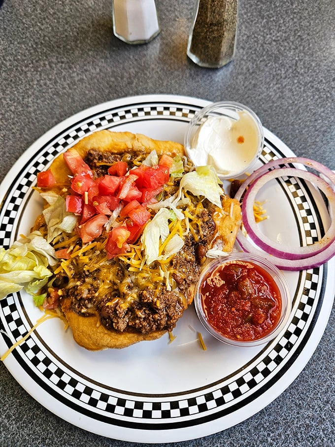 An open-faced masterpiece that proves Oklahoma knows its way around comfort food—this taco-inspired creation defies easy categorization.