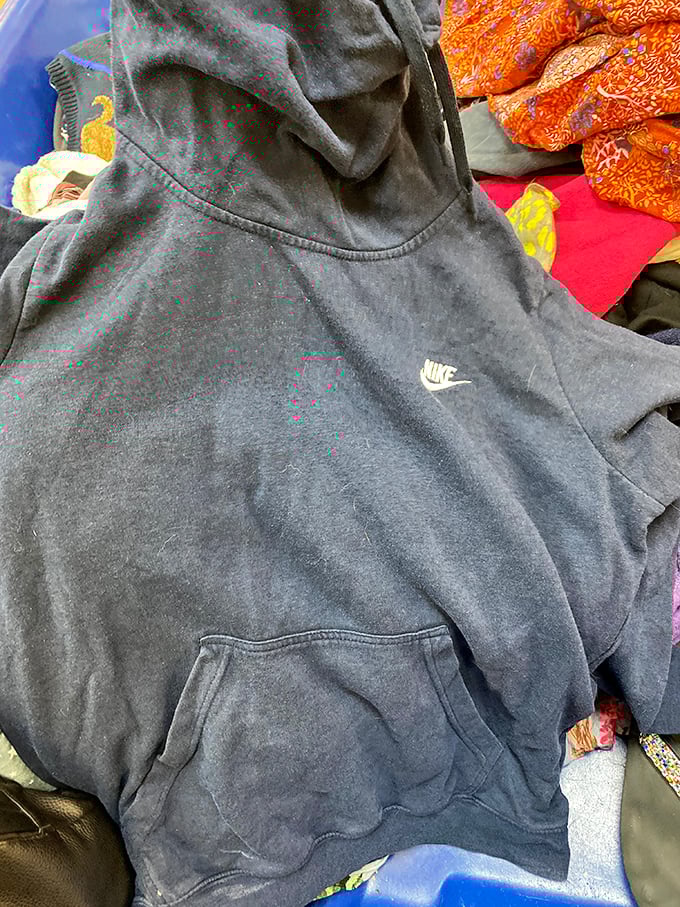 Hidden among the textile layers: a perfectly good Nike hoodie waiting for its second chance. One person's donation becomes another's favorite weekend loungewear.