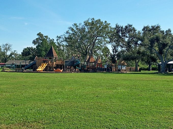 This playground nestled under majestic oak trees offers families affordable fun – where kids can play while parents enjoy Florida's natural air conditioning.