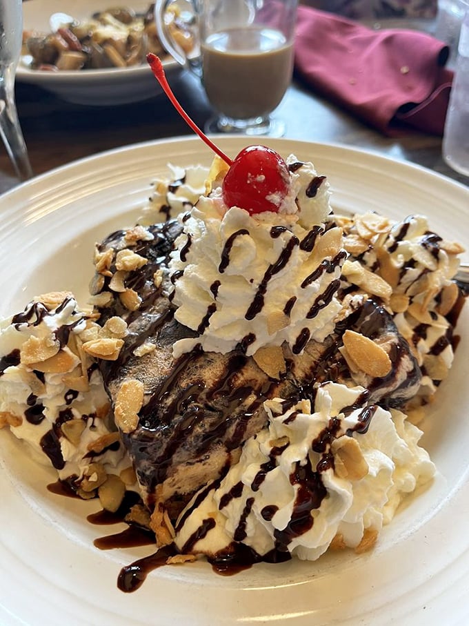 The Kona Pie isn't just dessert—it's what other desserts dream about becoming when they grow up. That cherry on top is just showing off.
