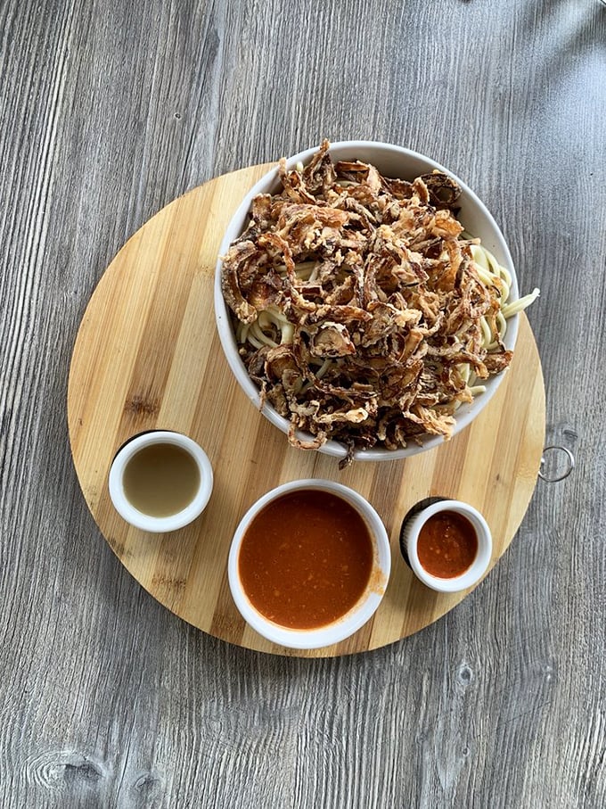 Koshari represents Egypt's national dish in all its glorious, multi-textured complexity - comfort food at finest.