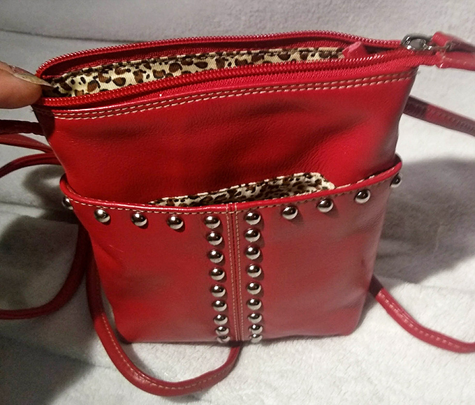 This sassy red handbag with leopard lining isn't just an accessory—it's waiting to become the main character in someone's outfit story.
