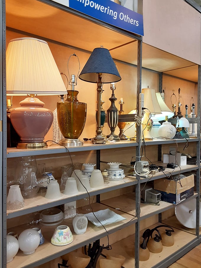 "Empowering Others" isn't just a sign – it's illuminated by vintage lamps waiting for their second act.