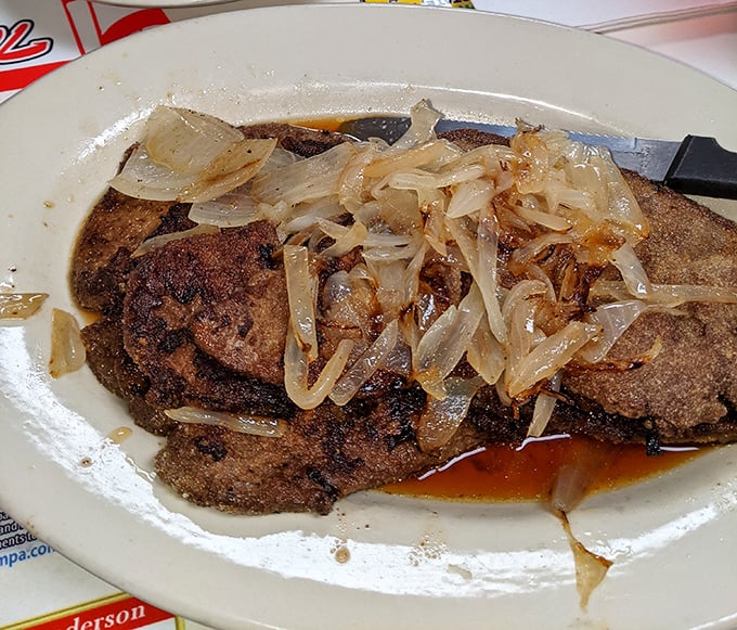 Liver and onions – the dish that separates casual diners from the true believers. Caramelized onions working overtime to create converts one plate at a time.