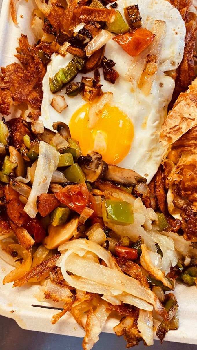 Hash browns become a canvas for culinary creativity, topped with everything that makes breakfast worth celebrating.