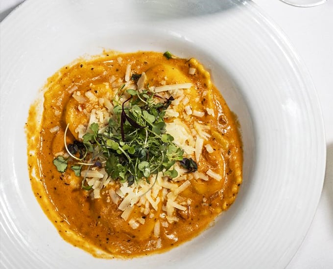 Lobster ravioli that makes you wonder why anyone bothers with plain cheese – each pillow of pasta hiding treasures from the deep.