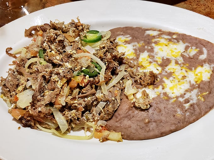 Machaca with beans—a plate that proves simplicity and complexity aren't mutually exclusive. Those jalapeños aren't just garnish; they're exclamation points.