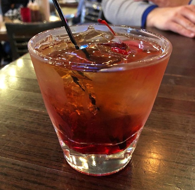 A proper Manhattan that doesn't mess around. The cherry isn't decoration – it's earned its place in this classic cocktail.