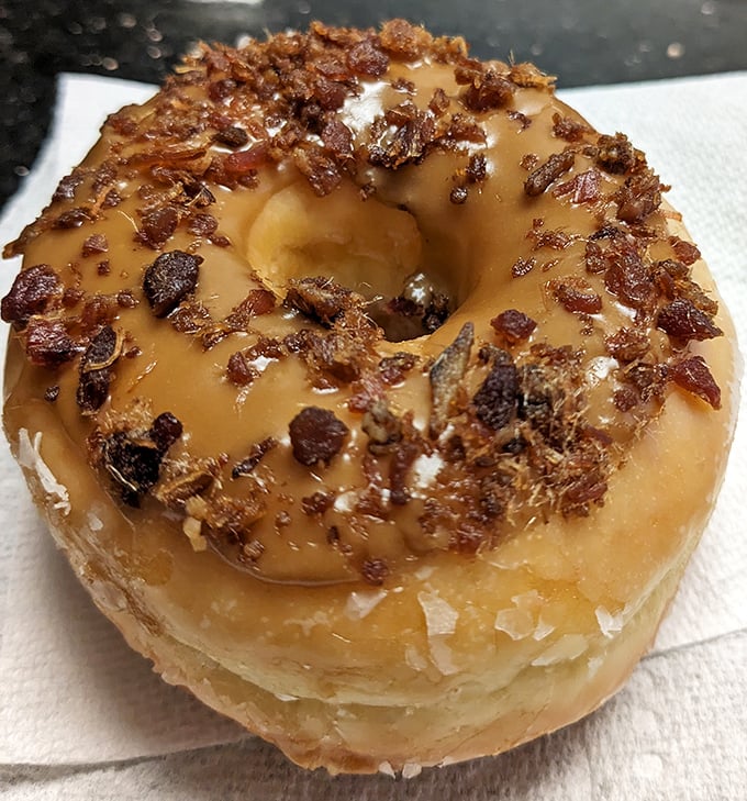The maple bacon donut—where breakfast's greatest hits collaborate on one magnificent stage. Sweet, savory, and utterly irresistible.