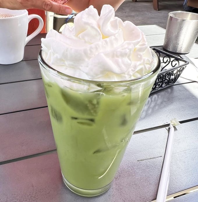 This matcha melon tea topped with cloud-like whipped cream isn't just a drink—it's what summer would look like if it were a beverage.