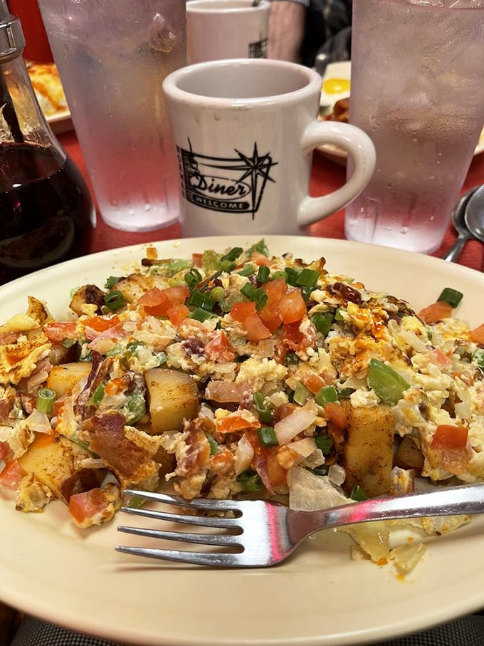 This isn't just breakfast—it's edible artwork. A colorful canvas of eggs, potatoes, and everything good in the world.